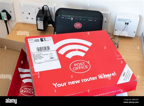 A Broadband Internet Router Connected To A Wall Socket Sent By The Post