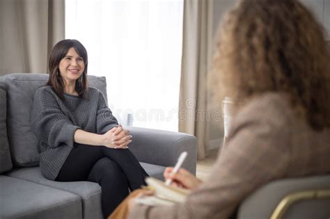 Woman Psychologist Talking To Patient Consulting At Psychotherapy