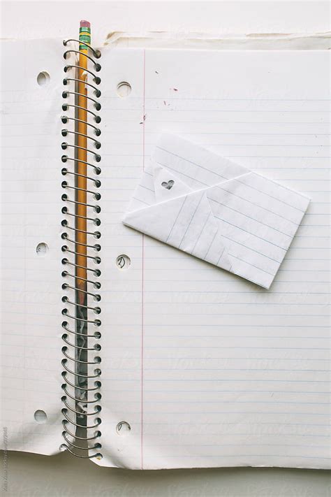Folded Love Note On An Open Notebook With Pencil By Stocksy