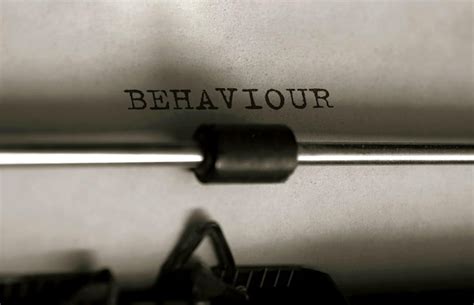 Premium Photo Text Behaviour Typed On Retro Typewriter
