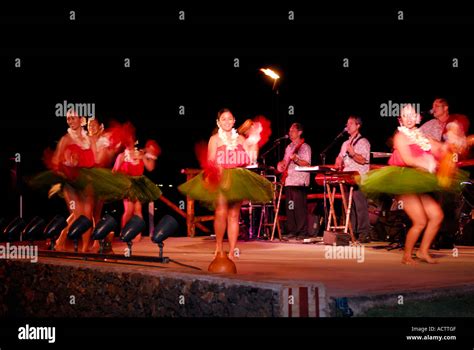Hula Performers Dancing On Stage At Night After A Luau In Maui Hawaii