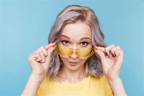 Premium Photo Portrait Of Surprised Cute Girl Posing Camera And