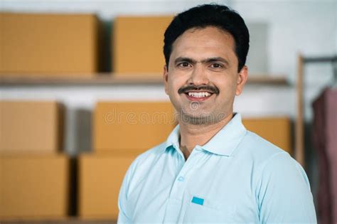 Happy Indian Corporate Employee Working On Laptop While Sitting At Office Concept Of