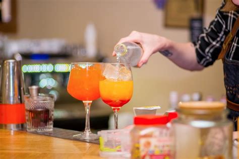 Premium Photo Mixology And Bar Night Life Bartender Girl Makes A