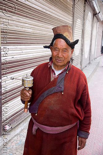 Tibetan Monk Spinning Prayer Wheel
