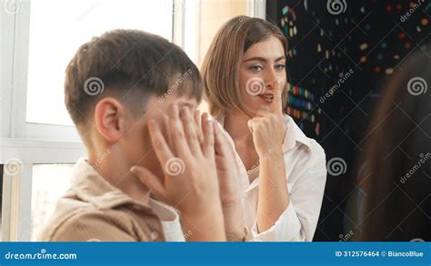 Beautiful Teacher Teach About Body Organ While Student Touch Nose