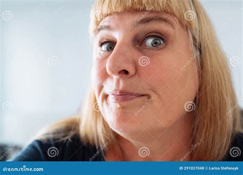 Portrait Middle Aged Woman Blonde Grimacing In Front Mirror Stock
