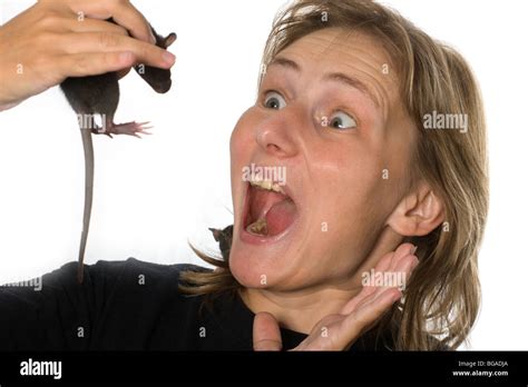 Scared Woman Crying With Horror Holding Little Rat In Her Hand