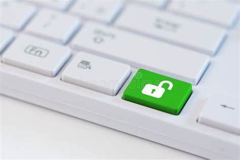 Green Key With Open Padlock Icon Symbol On Laptop Keyboard Stock Photo