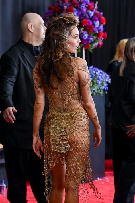 Miley Cyrus Wears See Through Gold Dress At The 2024 Grammys