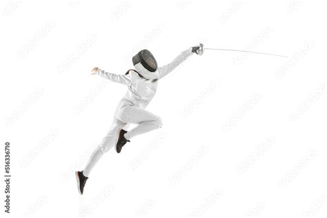 Young Girl Beginner Fencer In Fencing Costume And Mask Practicing With