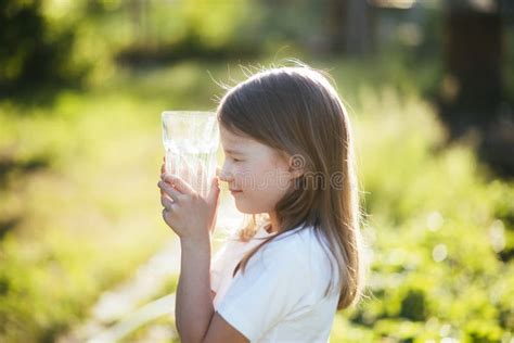 Girl Holding Glasses Of Water In Nature Stock Image Image Of White