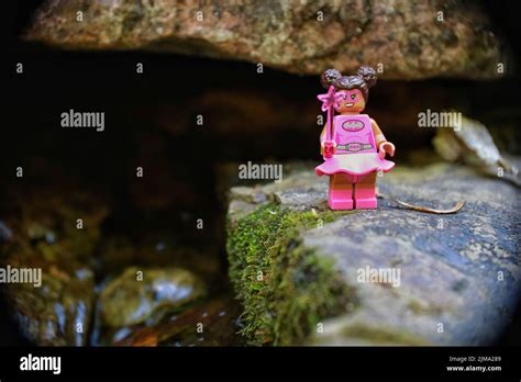 Lego Toy Of A Female Hero Figure Standing On A Rock Holding A Star Wand