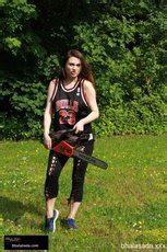 Solo Hottie Loves Posing With A Chainsaw Outdoors 15 Photos