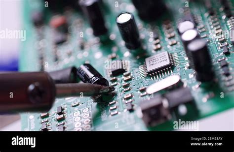 The Engineer Replaced The Ic Transistor With A Soldering Iron On The Stock Video Footage Alamy
