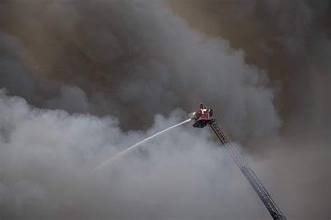 No Injuries Reported As Firefighters Battle Commercial Building Blaze