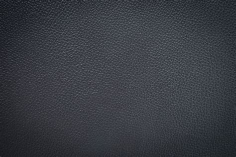 블랙 그레이 가죽 소재의 클로즈업 거친 추상적 인 어두운 검은 색 매트 배경의 표면 작업 배경에 디자인하고 텍스트용 개념 복사