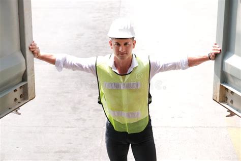 Inspector Worker Who Wears A Safety Helmet And Vest Opens The Container