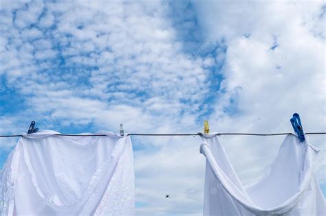 Premium Photo Clean Washed Bedding Is Dried On A Rope With