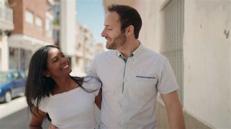 Man And Woman Interracial Couple Hugging Each Other At Street Stock
