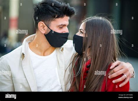 Portrait Of A Young Couple Wearing Masks Covid And Coronavirus Concept