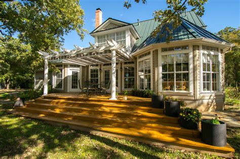 Attached Deluxe Vinyl Pergola With Canopies Attached To House