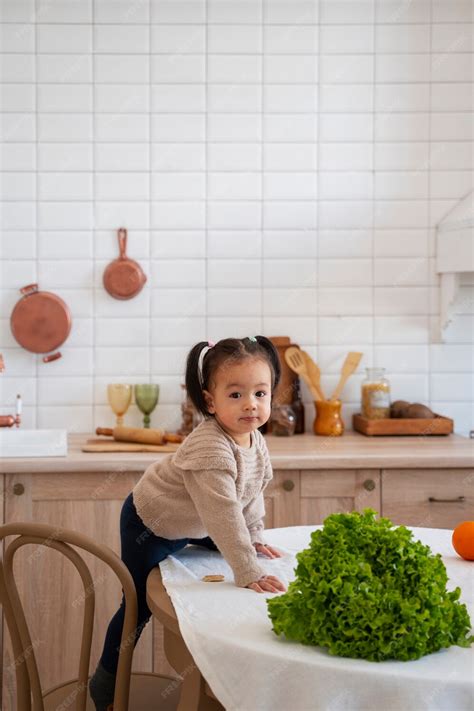 Free Photo Young Asian Girl In The Kitchen At Home