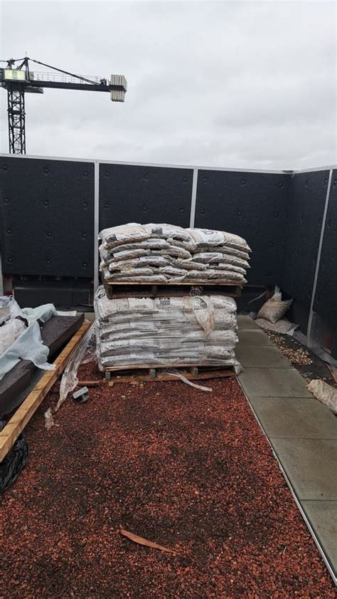 Construction Materials Stored On The Roof Of Construction Building