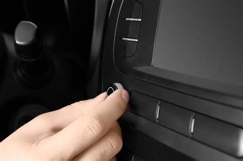 Premium Photo Man Tuning Radio In Car