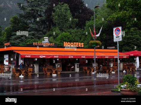 Diners Enjoying Their Food At The Famous Hooters Restaurant Situated On