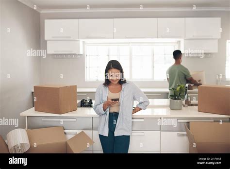 Im Messaging Our Friends To Come Help With The Unpacking Shot Of A