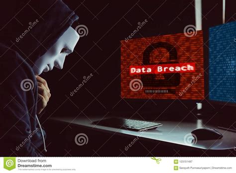 Masked Hacker Under Hood Using Computer To Commit Data Breach Cr Stock
