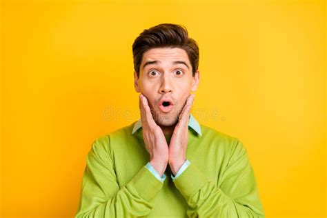 Portrait Of Young Handsome Shocked Surprised Amazed Man Hold Hands
