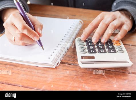 Woman Hand With Pen Writing On Notebook Stock Photo Alamy