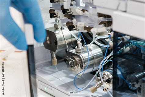 Scientist Hand Opens The Door With Binary Pump For Mixing For Hplc Gradient Formation And