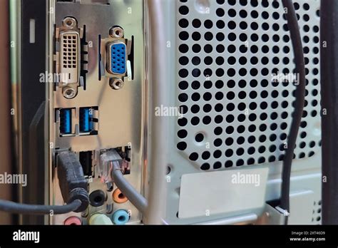 Computer System Unit Rear View The Motherboard Connectors Power Supply And Wires Are Visible