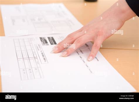 Human Hand Pointing Document On Table Stock Photo Alamy