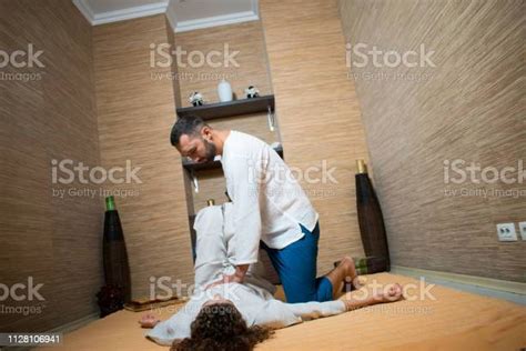 Tibetan Massage The Massage Therapist Makes A Tibetan Massage To A