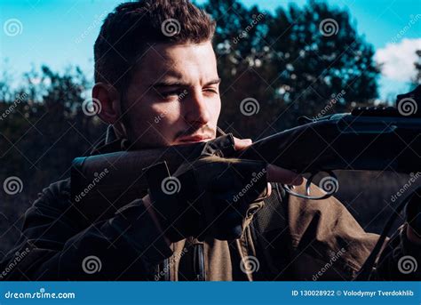 Portrait Of Hamdsome Hunter Hunter With Shotgun Gun On Hunt Man
