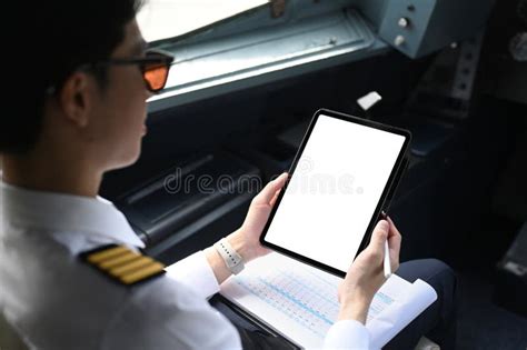 Pilot Preparing Flight Path And Check List From Digital Tablet In The Airplane Cockpit Stock