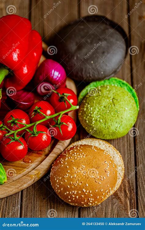 Top View Closeup Of Three Colorful Hamburger Buns With Vegetables