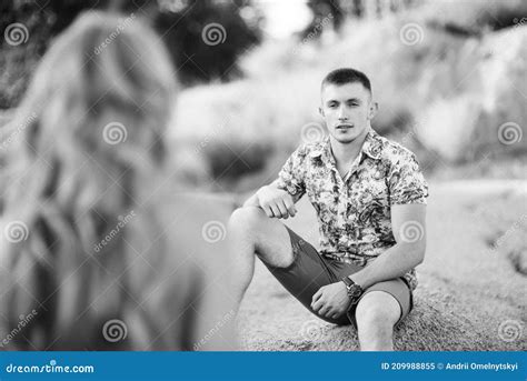 Blonde Girl In A Light Blue Dress And A Guy In A Light Shirt In A
