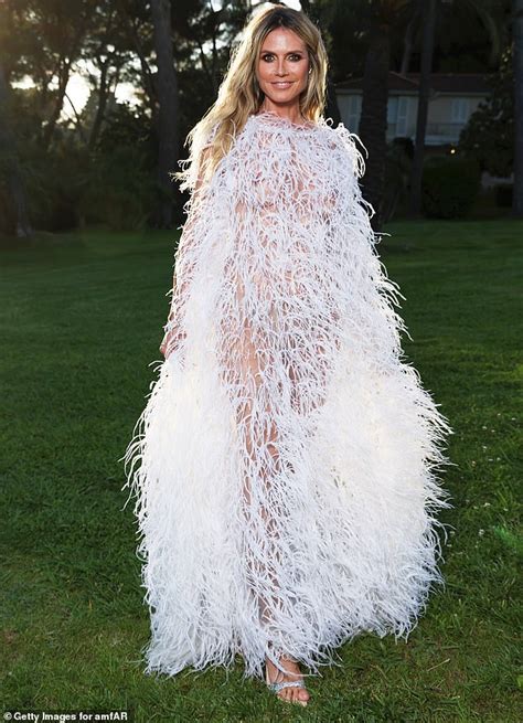 Heidi Klum Barely Protects Her Modesty In A Semi Sheer White Feathered