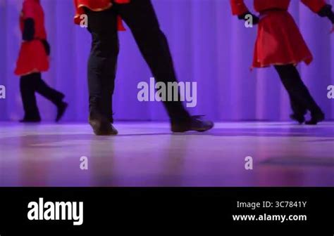 Unrecognizable Dancers Are Dancing A Cossack Dance Close Up Of The