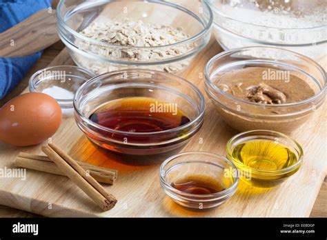 Dry And Liquid Ingredients For Baking Including An Egg And Cinnamon