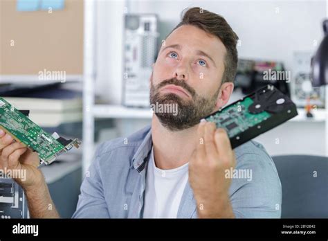 Lab Engineer Holding Broken Hard Disk Stock Photo Alamy