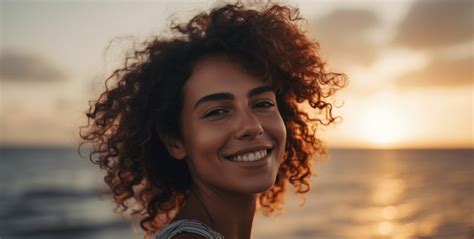 Premium Ai Image A Woman Smiles At The Sunset With The Sun Setting