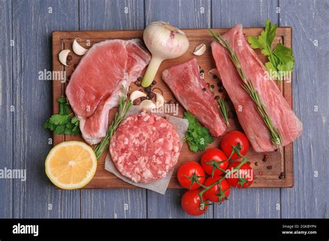 Wooden Board With Different Types Of Meat On Table Stock Photo Alamy