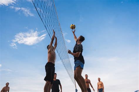 Teams With Multinational Players Play Beach Volleyball On The Beach In
