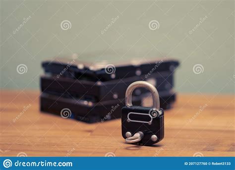 Computer Hard Disks And Metal Padlock Symbolizing Concept For Encrypted